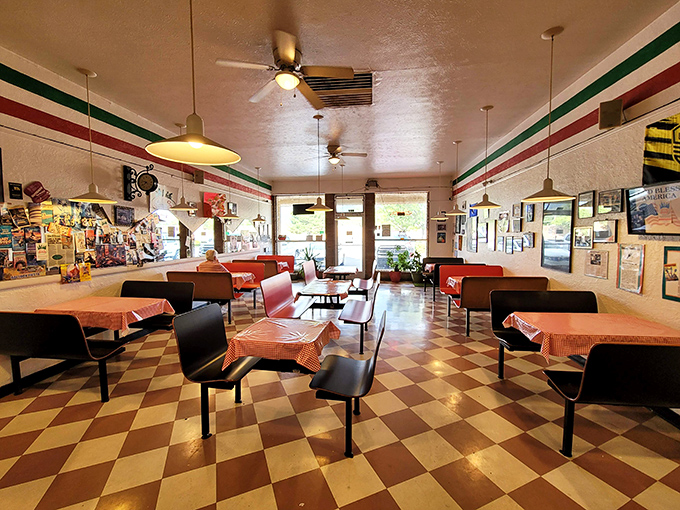 Classic Italian checkered tablecloths and ceiling fans spinning stories of decades of pizza perfection at Giovanni's.