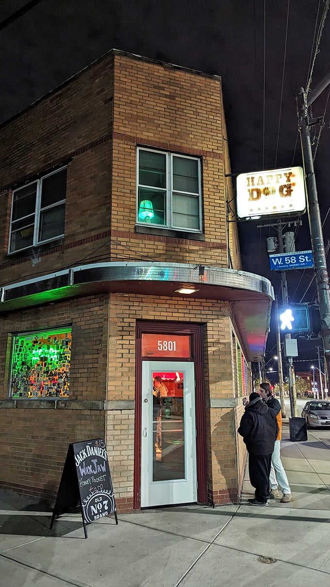 Night falls and Happy Dog's neon sign becomes a beacon for Cleveland's hot dog pilgrims seeking tater tots and topping adventures.