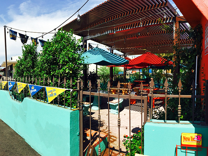 Colorful umbrellas and vibrant décor create an oasis of seafood authenticity that makes you forget you're surrounded by cacti.