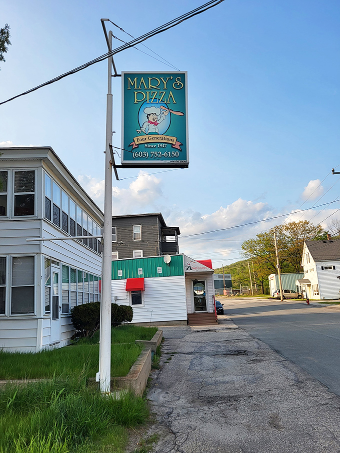 That vintage sign isn't just advertising&mdash;it's a time machine to when pizza was honest, generous, and made with love.