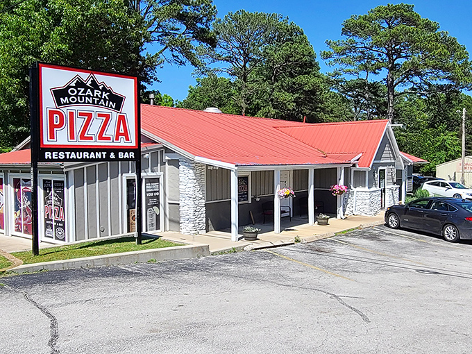 Red roof, stone accents, pizza perfection. This cabin-like pizzeria captures the Ozarks spirit in both architecture and taste.