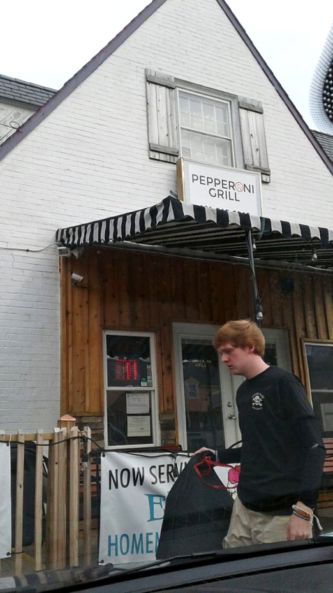  The wooden facade and striped awning say "nothing fancy here"&mdash;until you taste pizza that belongs in a culinary museum.