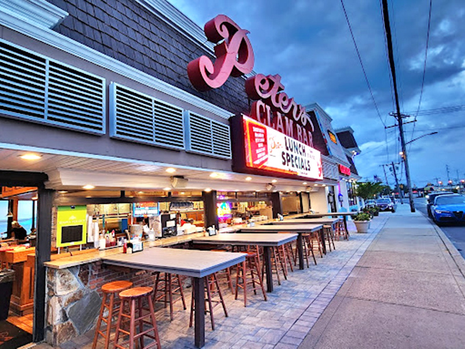 The casual outdoor counter seating at dusk turns ordinary seafood dinners into luminous summer memories. Pure Long Island magic!
