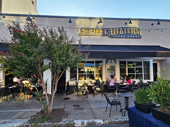 Outdoor tables at Sweet Waters where "people watching" is just a noble excuse for "waiting for someone else's steak to walk by."