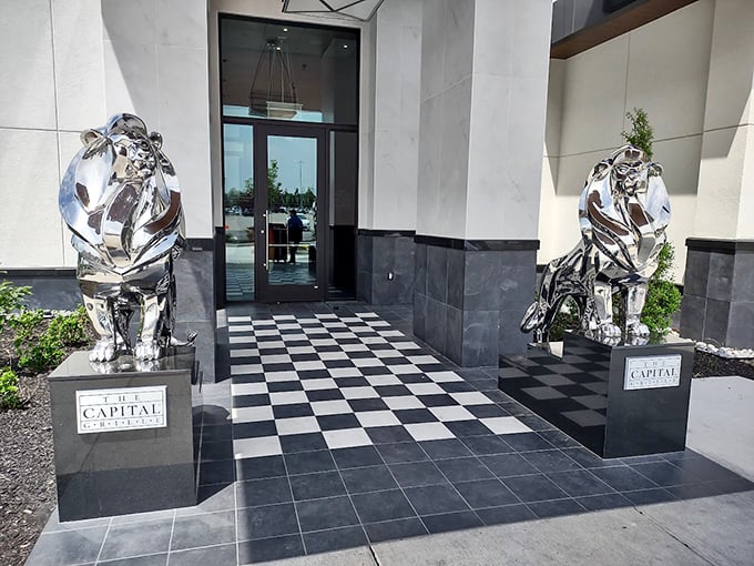 The Capital Grille (entrance): "Shiny metal lions guard the entrance like bouncers at the world's most delicious meat party."