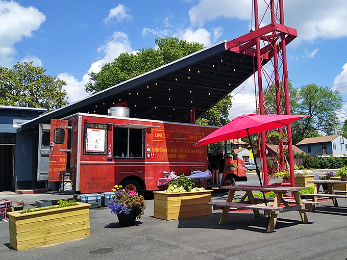 When you see a red food truck flying multiple flags, prepare for a U.N. summit of flavors. Uncle John's BBQ Stand brings diplomacy through smoke.