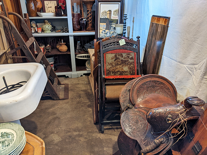 Western saddles and porcelain sinks&mdash;unexpected neighbors in this corner where the Wild West meets Victorian bathroom design.