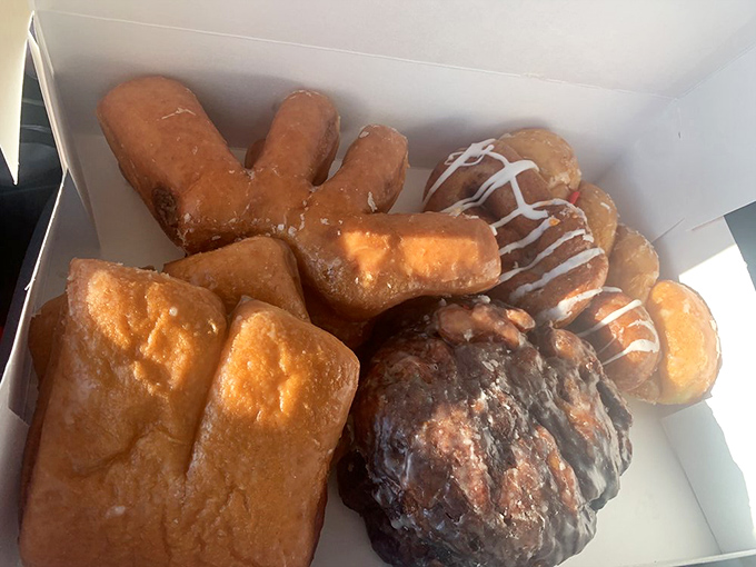 Holy fritter, Batman! This isn't just an apple fritter; it's a work of art that belongs in the Louvre... of deliciousness.