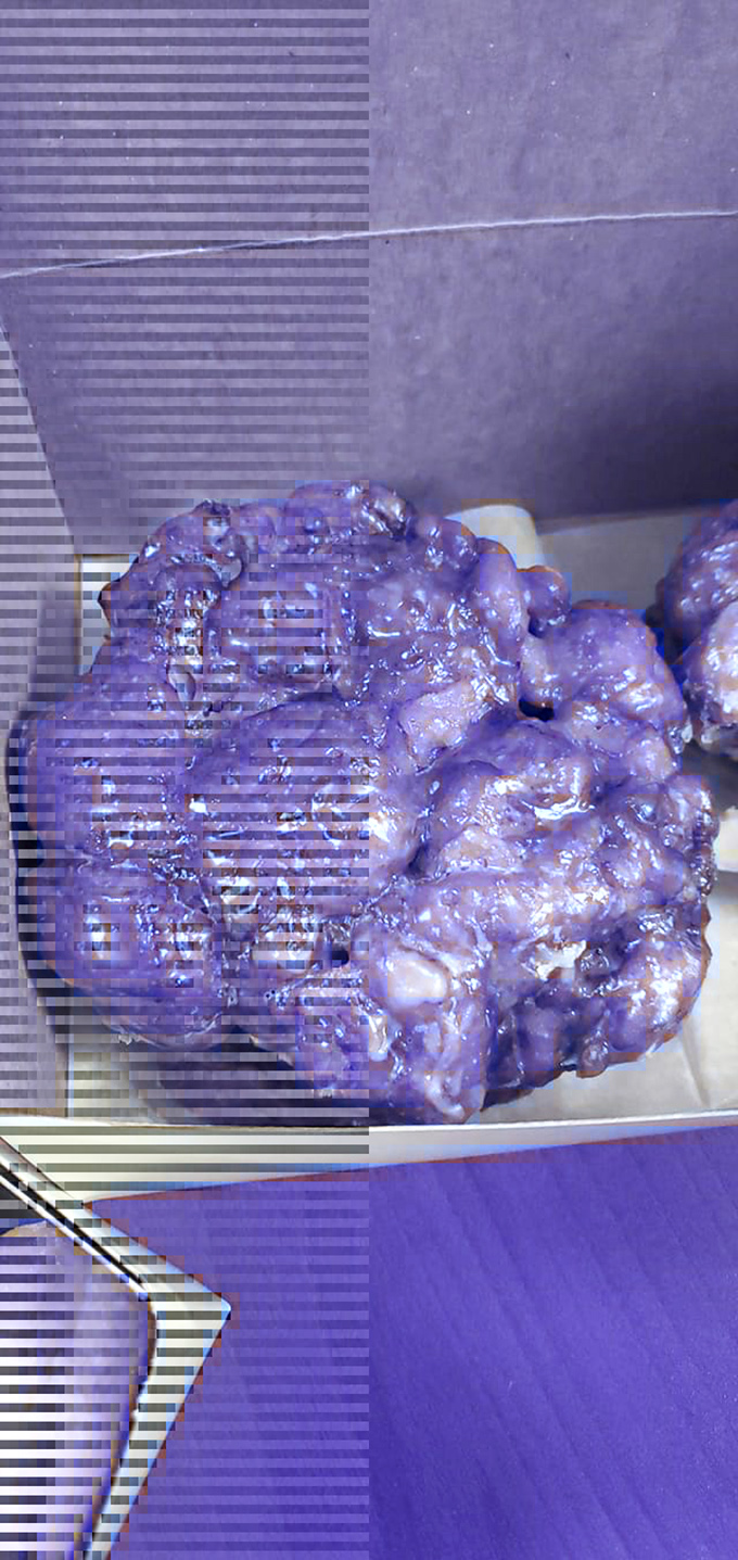 This purple-glazed beauty looks like it belongs in a donut art gallery. Picasso would've called it "Frosting in Blue Period."