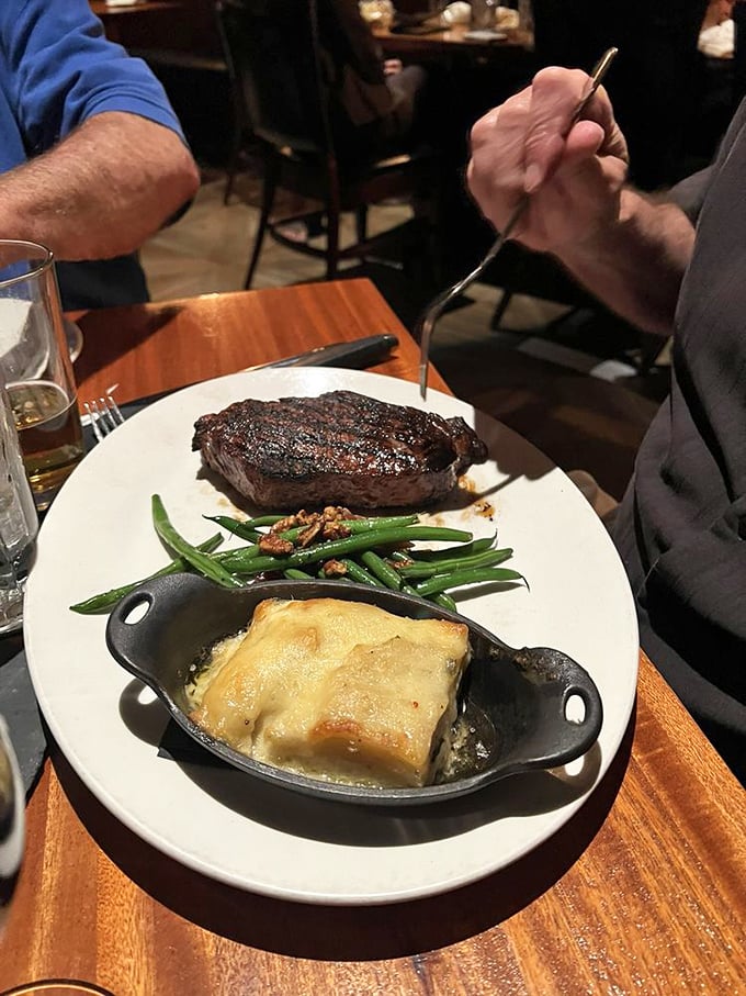 Someone's about to have a religious experience with beef. That knife isn't cutting steak&mdash;it's conducting a symphony of flavor.