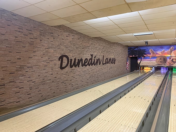 The stone wall backdrop adds unexpected elegance to lanes that have witnessed countless celebrations, first dates, and "I meant to do that" gutter balls.