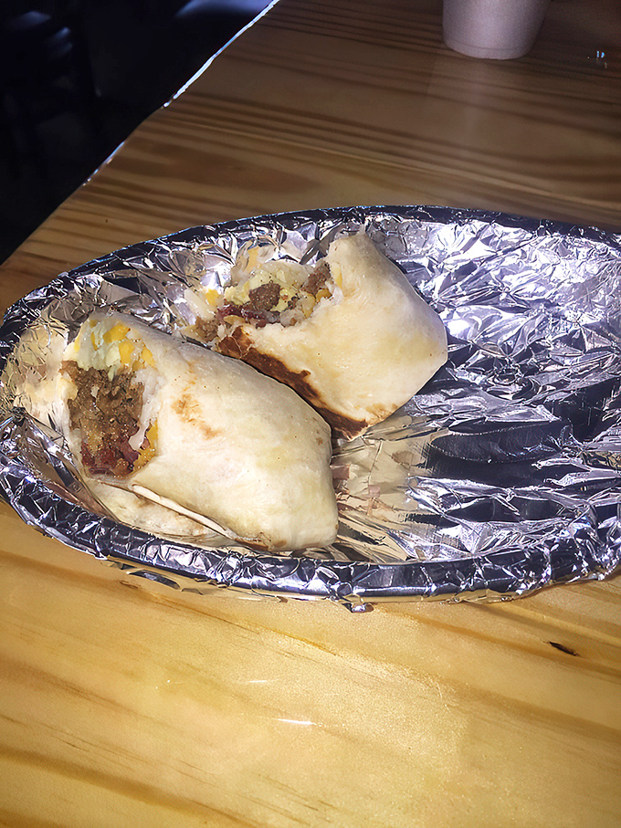 The cross-section reveals the truth&mdash;no skimping here! Like a geological expedition through layers of breakfast bliss on a foil plate.