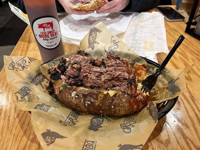 A loaded baked potato transformed into a throne for pulled pork &ndash; where humble spuds meet royalty and everyone wins.