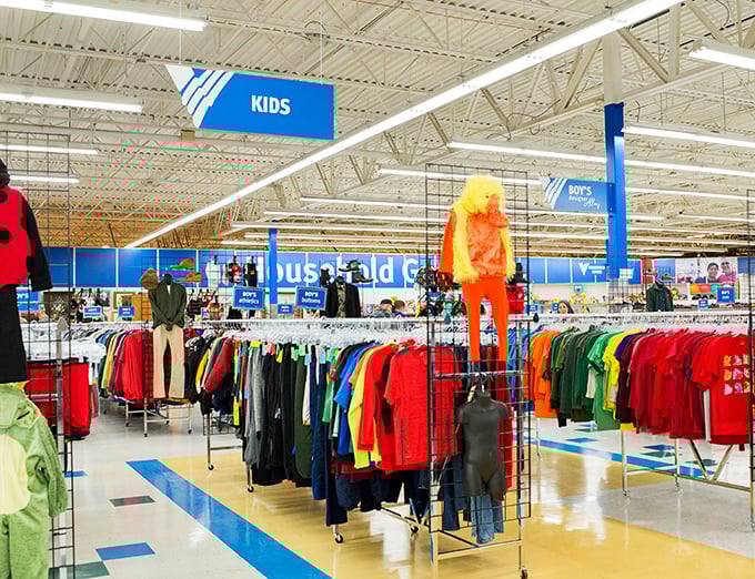 The children's section bursts with primary colors, a rainbow road of hand-me-down possibilities for growing kids and shrinking wallets.