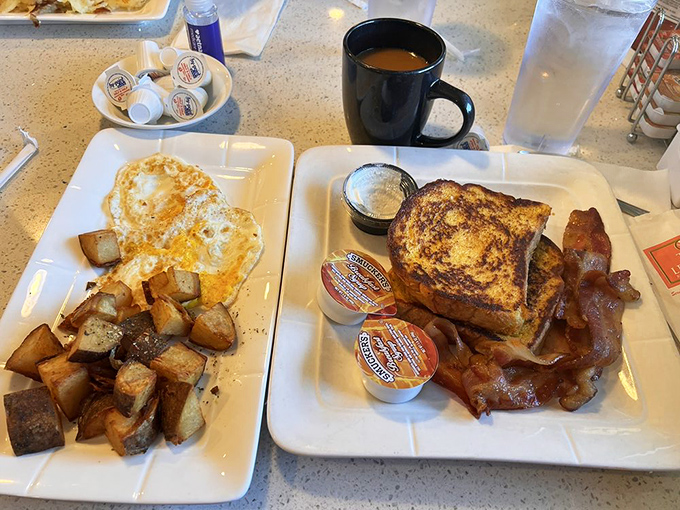 French toast that's had a proper education in caramelization, with bacon standing guard to ensure no bite goes unappreciated.