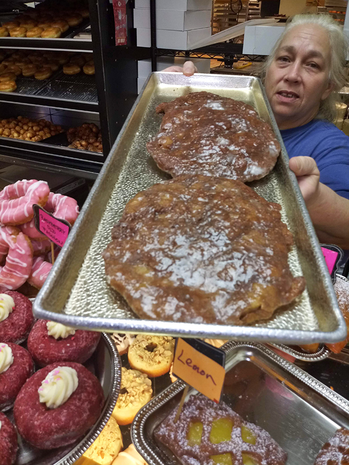Fresh from the kitchen, these apple fritters are the Mona Lisas of the donut world &ndash; masterpieces of caramelized artistry.