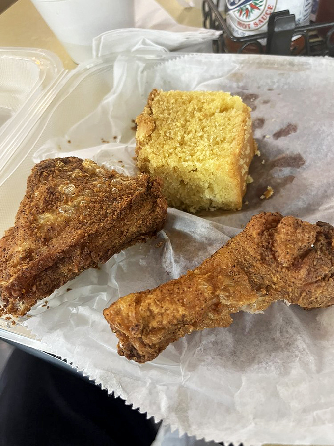 The holy trinity of Southern comfort: perfectly seasoned fried chicken, golden cornbread, and the promise of a nap afterward.