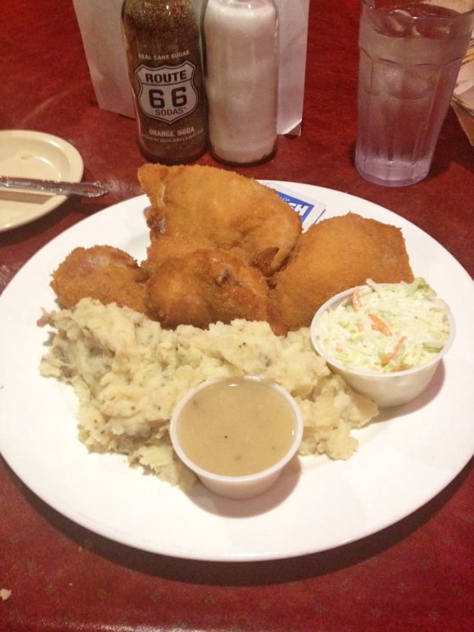 A proper chicken dinner comes with all the fixings&mdash;creamy mashed potatoes, gravy, and coleslaw. That Route 66 soda is the perfect nostalgic pairing for this roadside classic.