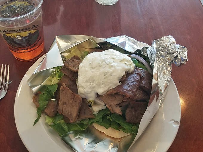 When your gyro requires structural engineering to eat, you know you're in the right place. That mountain of meat with tzatziki lava deserves respect.