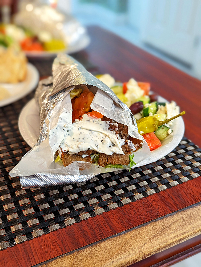 The lunch of champions: A proper gyro unwrapped like a present, with a Greek salad that could make Zeus himself shed a tear of joy.