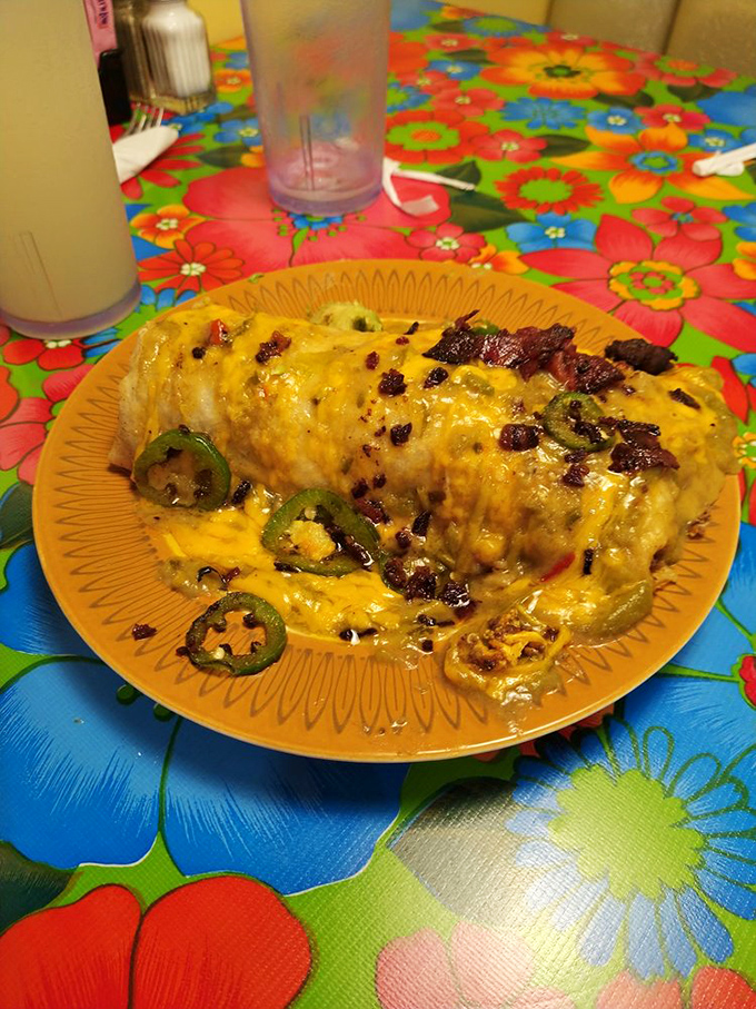 This burrito isn't just big—it's life-changing. Topped with jalapeños and bacon bits, it's the breakfast equivalent of winning the lottery.