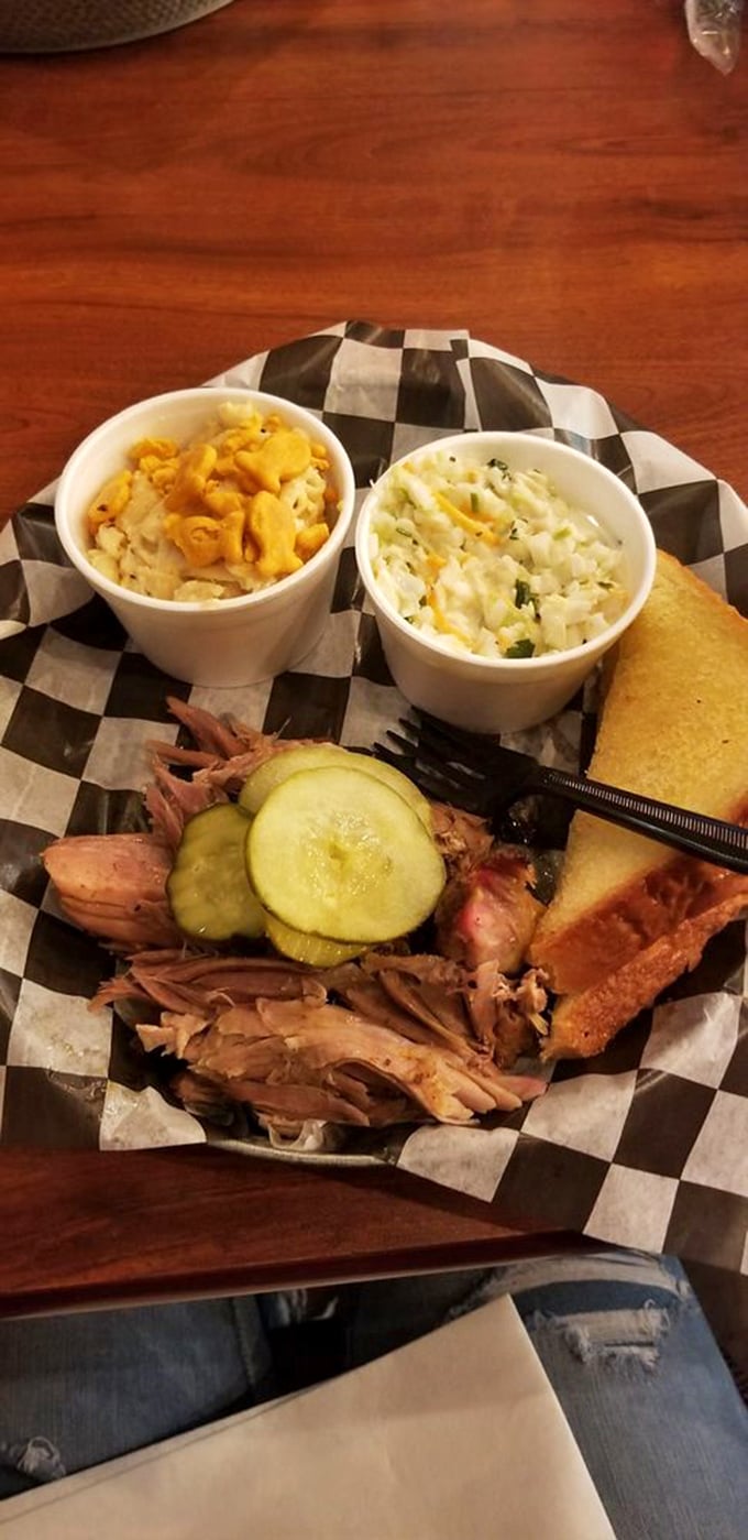 This isn't just a meal; it's a Southern symphony on a checkered paper. The mac and cheese looks like it could win awards if comfort food had Olympics.