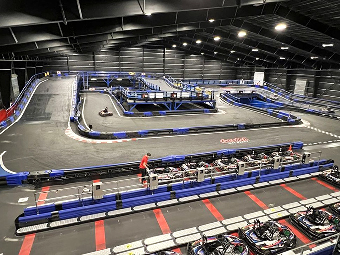 A racetrack designed by someone who understands the perfect balance between terror and exhilaration. Those blue barriers have stories to tell.