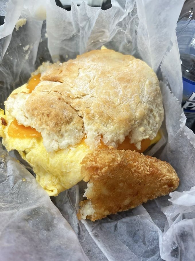 Breakfast architecture at its finest&mdash;golden biscuit cradling fluffy eggs and cheese with a perfect sausage foundation. Engineering you can eat.