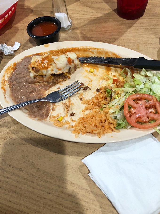The half-eaten plate tells the whole story&mdash;these enchiladas don't stick around for long. That fork is poised for the next heavenly bite.