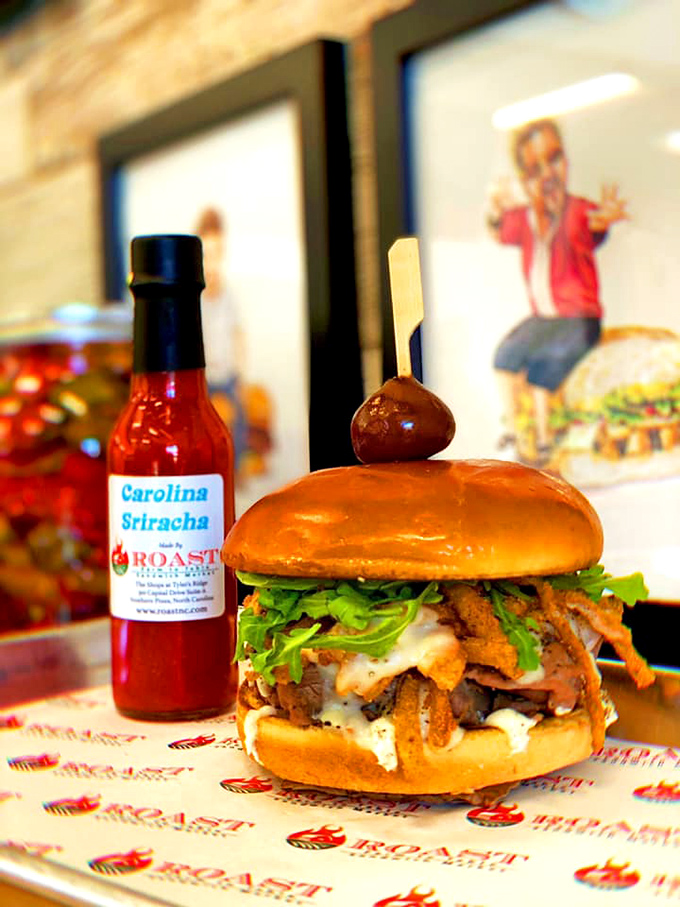 Carolina Sriracha stands guard beside a tower of deliciousness that manages to be both sophisticated and gloriously messy at the same time.