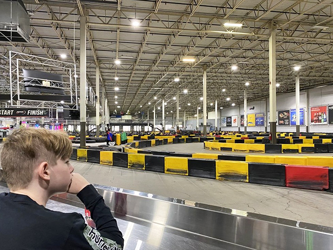 Young spectators watch from the sidelines, mentally recording every turn and technique for when it's their turn to take the wheel.
