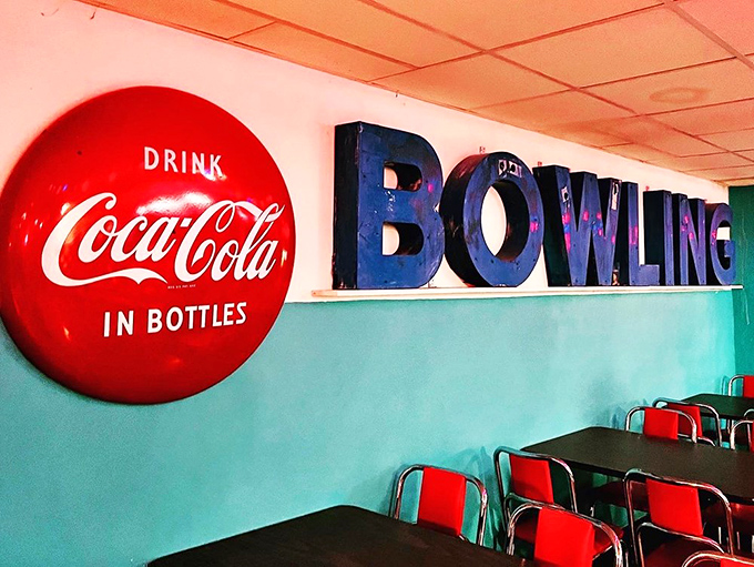 That classic Coca-Cola button sign pairs perfectly with blue bowling letters&mdash;like comfort food for your nostalgic soul.