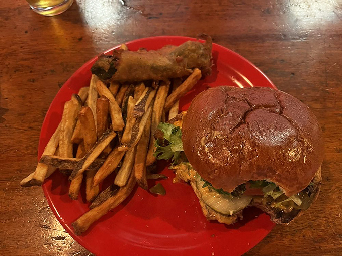 Handcut fries and a burger on a red plate&mdash;simple pleasures executed perfectly. The kind of meal that makes you question why you ever eat anywhere else.