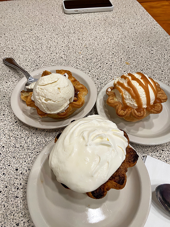 A trio of cream pies that could make a grown adult weep with joy. Notice how no one's rushing to share&mdash;some pleasures are too good to divide.