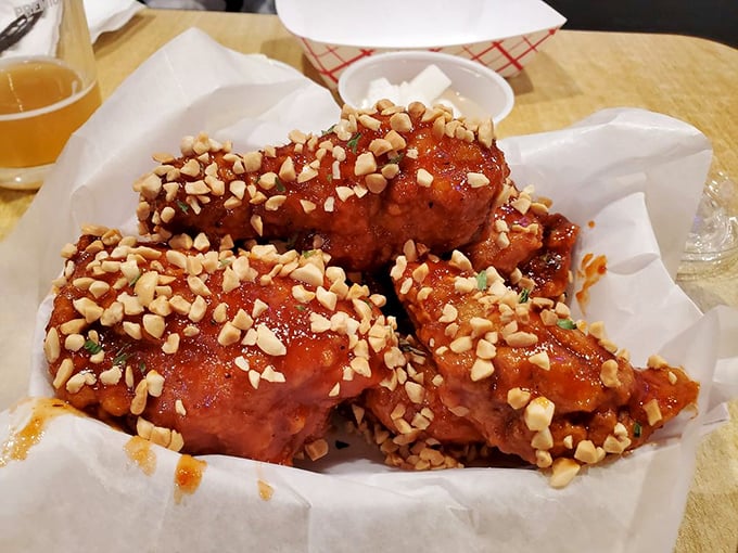 These sauce-lacquered drumsticks, topped with crushed peanuts, are what chicken dreams about becoming when it grows up.