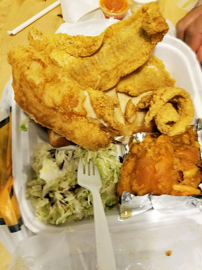 The holy trinity of comfort food &ndash; crispy whiting, creamy coleslaw, and something fried and golden that's calling my name from that foil wrapper.