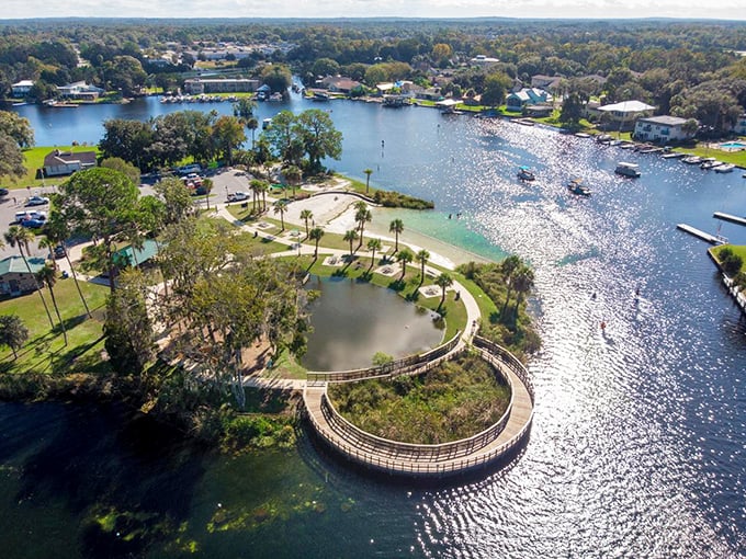 Hunter Springs Park's curved boardwalk embraces crystal-clear waters. From above, you can see why this natural swimming area is a refreshing alternative to chlorinated hotel pools.