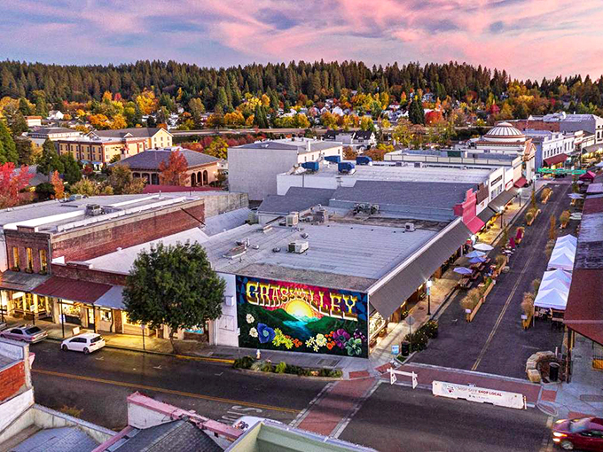 Grass Valley unfurls like a patchwork quilt from above, its colorful downtown nestled among autumn-kissed foothills and evergreen sentinels.