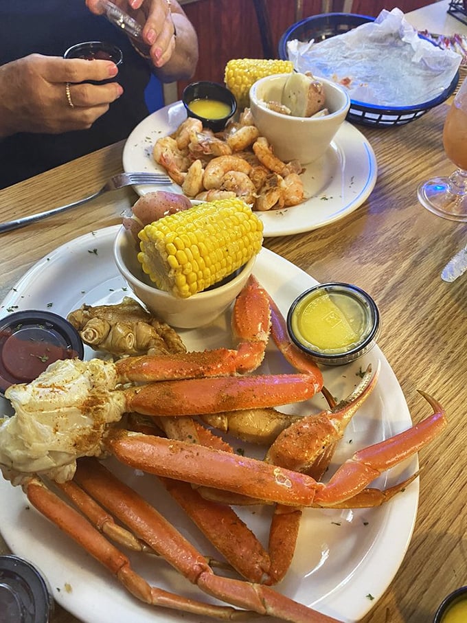Crab legs so impressive they deserve their own zip code. That drawn butter isn't optional—it's essential equipment for this seafood expedition.