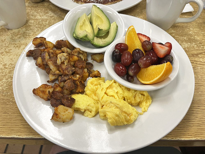 Breakfast perfection isn't complicated: fluffy eggs, seasoned potatoes, fresh fruit, and the avocado that Instagram dreams are made of.