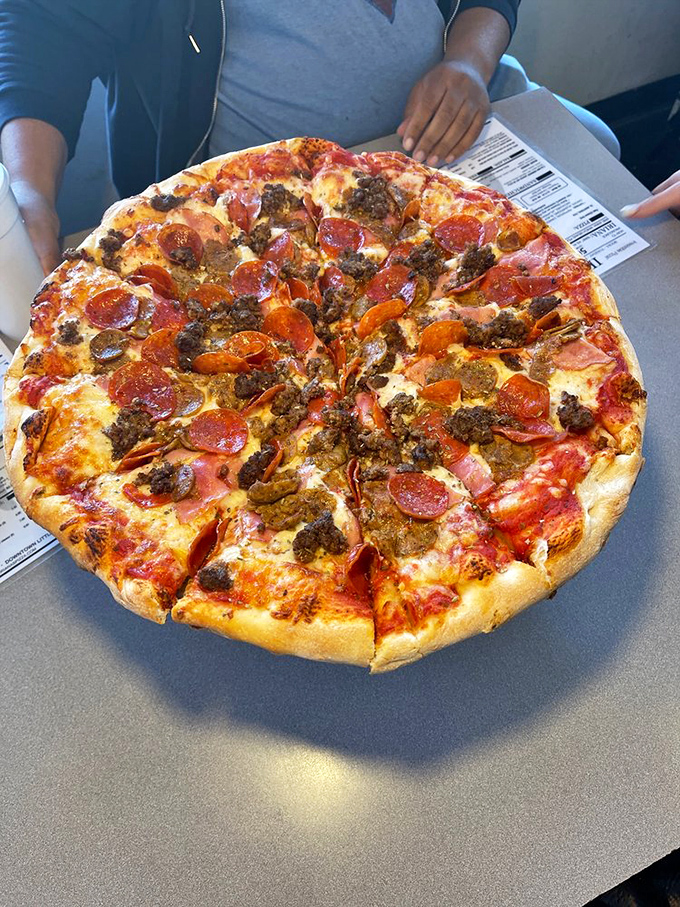 The All Meat pizza doesn't just talk the talk—it's a carnivore's dream that makes vegetarians temporarily question their life choices.