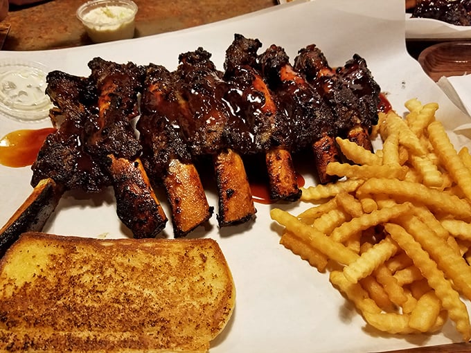 These ribs have more bark than your neighbor's annoying dog, but infinitely more appealing. The meat's not falling off the bone—that would be overcooked—it's clinging just enough.