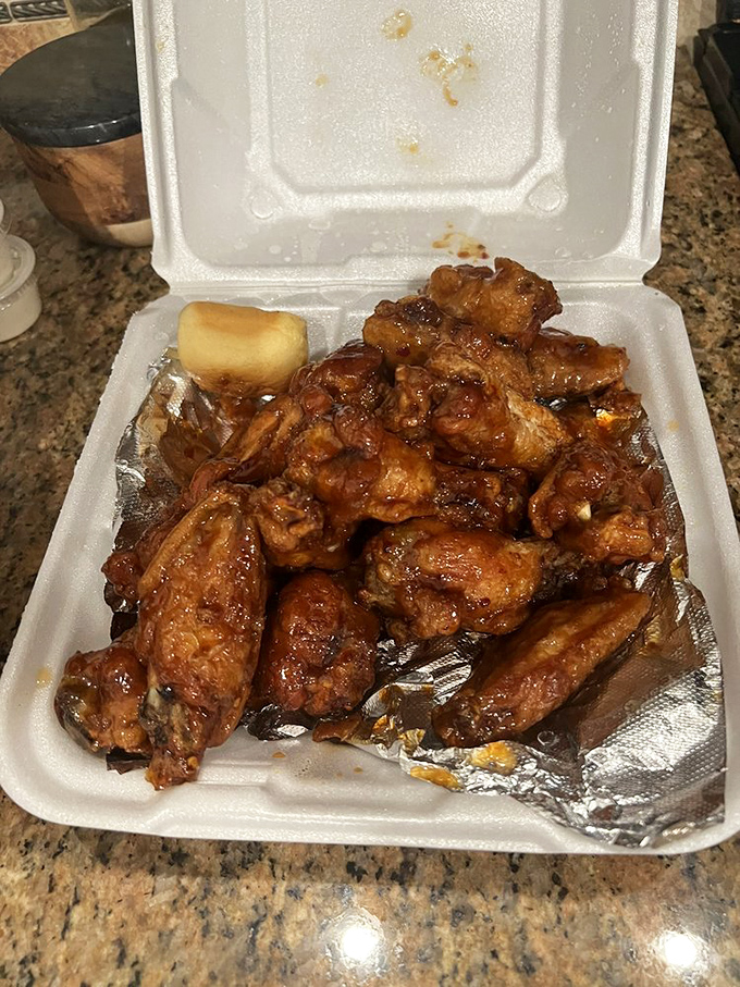 These BBQ wings aren't just food; they're a sticky, sweet, tangy argument for keeping wet wipes in your glove compartment.