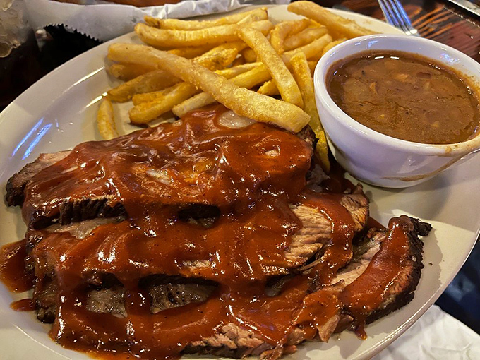 BBQ brisket that doesn't just fall apart – it surrenders with dignity, draped in a sauce that should have its own fan club.