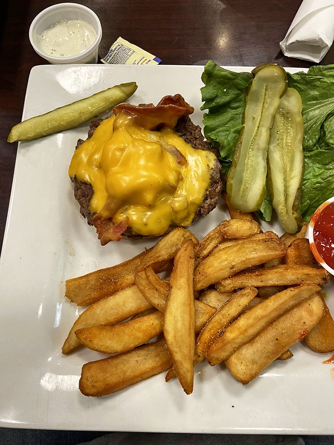 The cheeseburger that launched a thousand road trips. Those golden-brown steak fries aren't sidekicks &ndash; they're co-stars in this delicious drama.