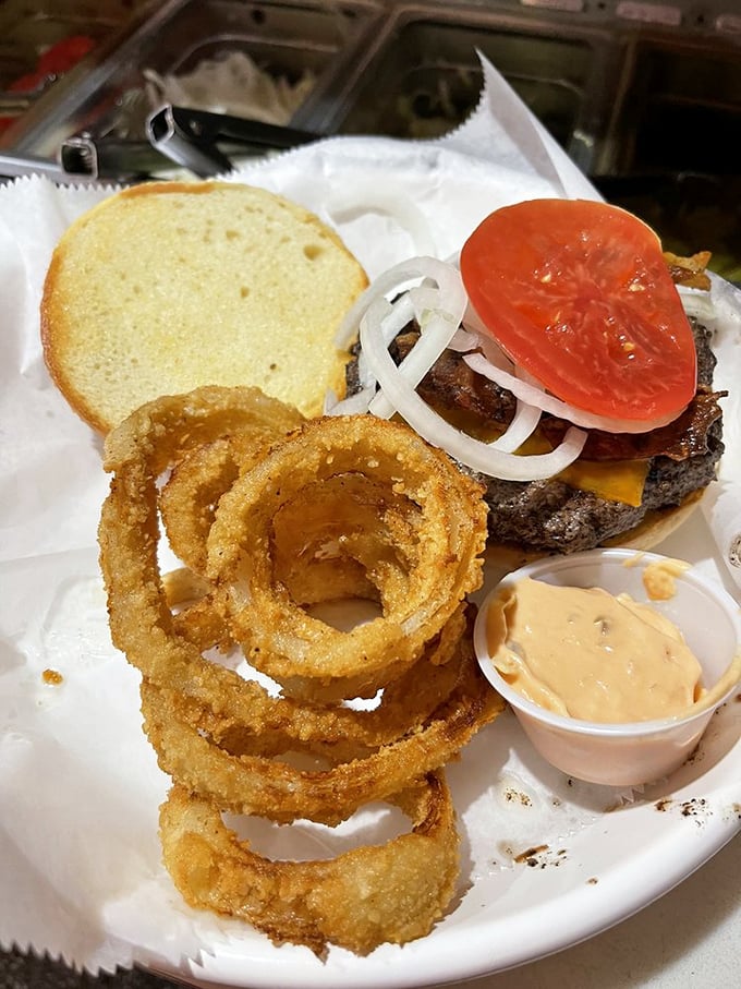 Those crispy onion rings aren't just sides&mdash;they're halos celebrating the burger's heavenly status in Kansas City's food scene.