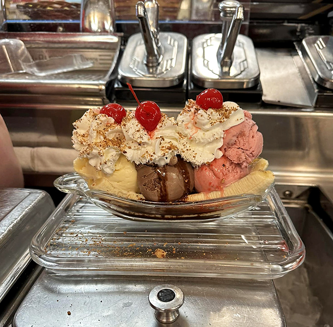 This isn't just a banana split—it's architecture with whipped cream, a monument to indulgence that demands both a spoon and a strategy.
