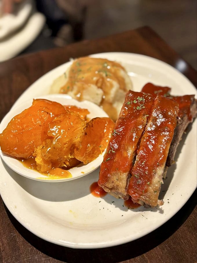 The BBQ ribs are so tender they barely cling to the bone, while those candied yams could make even vegetable skeptics swoon with delight.