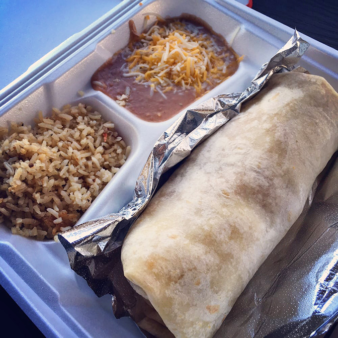 Not all heroes wear capes—some come wrapped in tortillas with perfectly seasoned rice and beans standing guard on the side.
