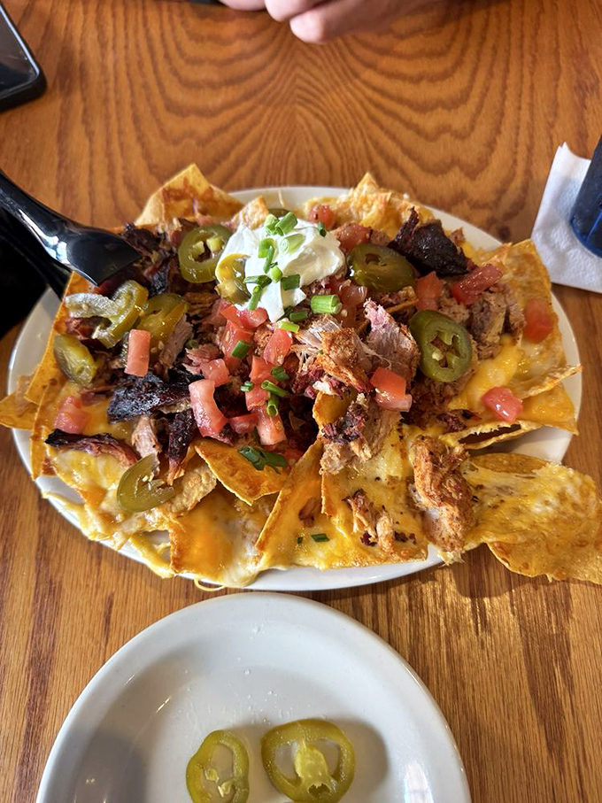 BBQ nachos: where Tex meets Mex in a glorious pile of crispy chips, tender brisket, and enough toppings to make sharing a moral dilemma.